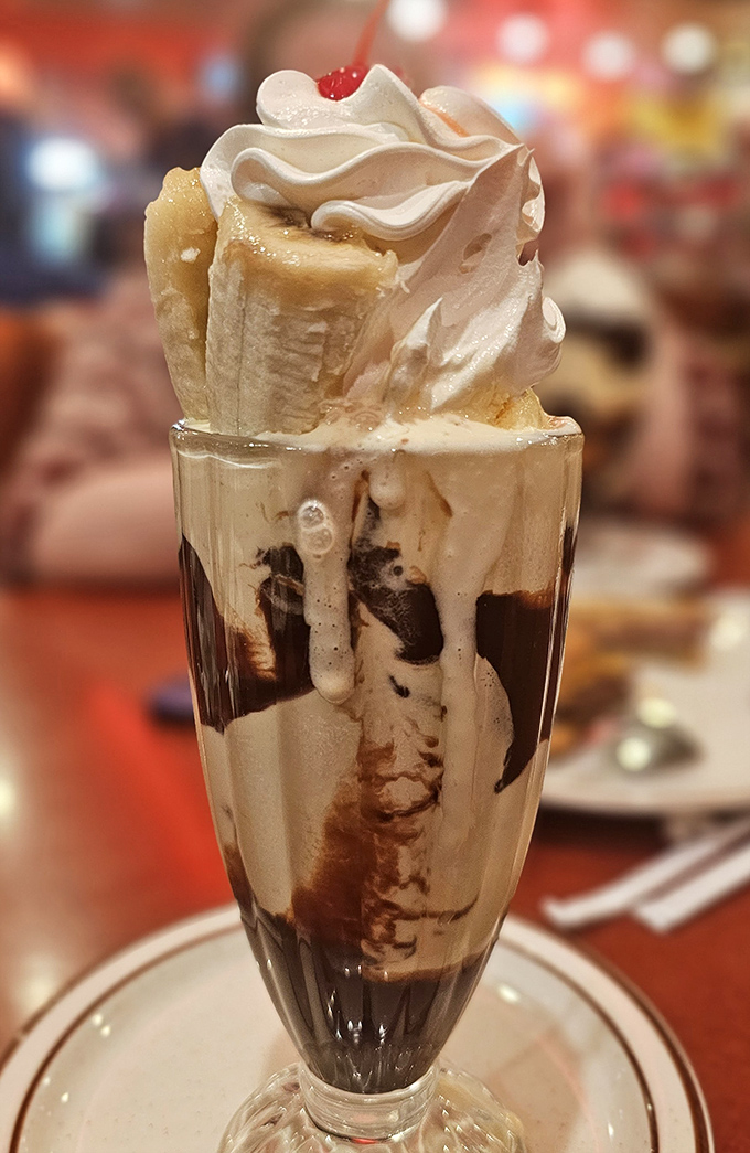 This isn't just a banana split milkshake&mdash;it's dessert engineering that makes physicists wonder how something so tall can be so beautiful.