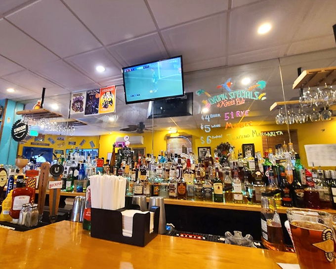 The bar at Koco's isn't trying to reinvent mixology—it's perfecting the art of pouring exactly what you want while you wait for crab cake nirvana.