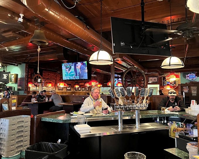 The bar area serves as Kodiak's unofficial town hall, where fishing tales grow taller with each pint and the copper ductwork gleams like a steampunk fantasy.