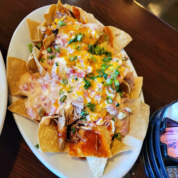 BBQ nachos that blur the line between Tex-Mex and Southern cuisine. When tortilla chips meet pulled pork and melted cheese, everyone wins.