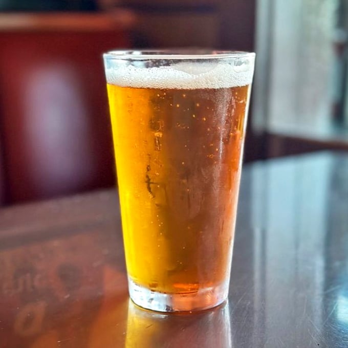 Liquid gold that washes away workday woes. Nothing complements smoky BBQ quite like a cold, crisp beer that seems to whisper, "You've made excellent life choices today."