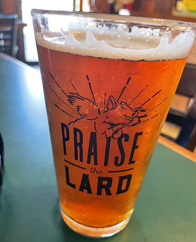 A "Praise the Lard" beer glass that perfectly captures the religious experience that is proper barbecue in the American heartland.