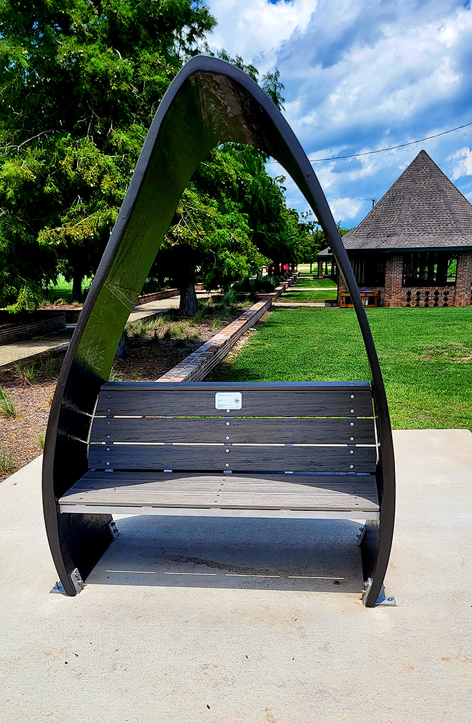 Not just a bench, but a front-row seat to nature's theater. The curved design feels like being cradled by the outdoors itself.