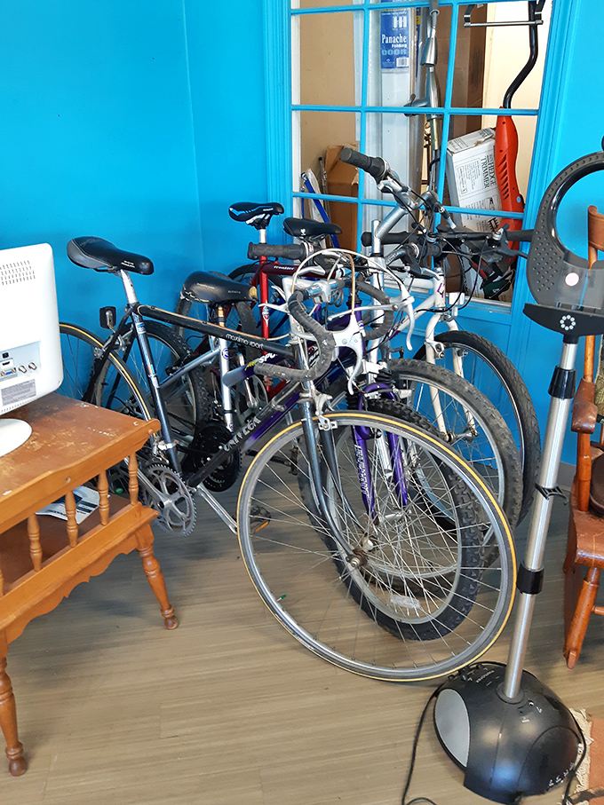 A blue-walled bicycle sanctuary where two-wheeled freedom machines await their next adventure partner.