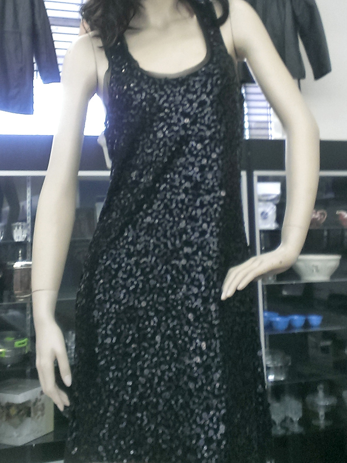 This sequined black dress on a mannequin whispers of nights out dancing and special occasions yet to come.