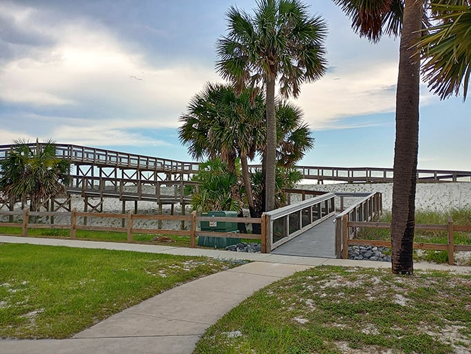 The boardwalk stroll that launched a thousand Instagram posts. Palm trees stand guard as you make your way to paradise.
