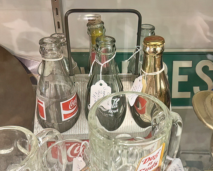 Vintage soda bottles stand at attention like soldiers from the cola wars, each one a fizzy time capsule from America's carbonated past.