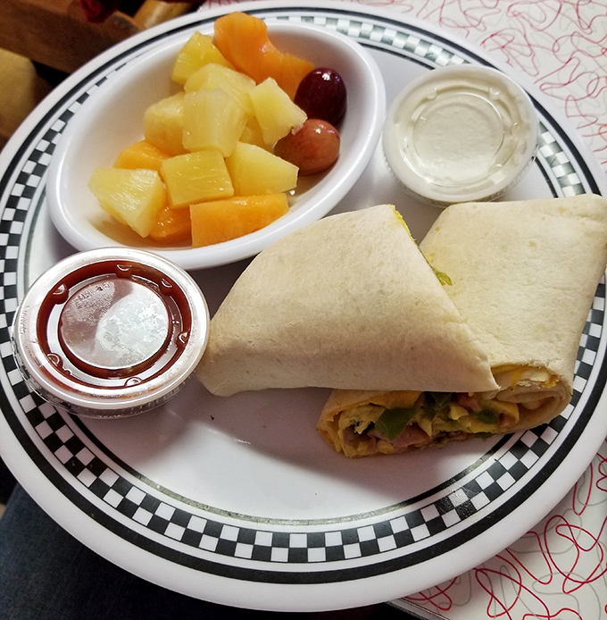The breakfast burrito comes with fresh fruit that almost makes you feel virtuous about the cheesy goodness wrapped inside.