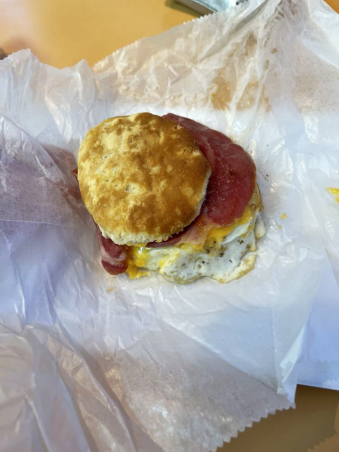 Breakfast nirvana on wax paper. This country ham and egg biscuit doesn't need fancy plating&mdash;it lets the gooey, savory goodness speak for itself.