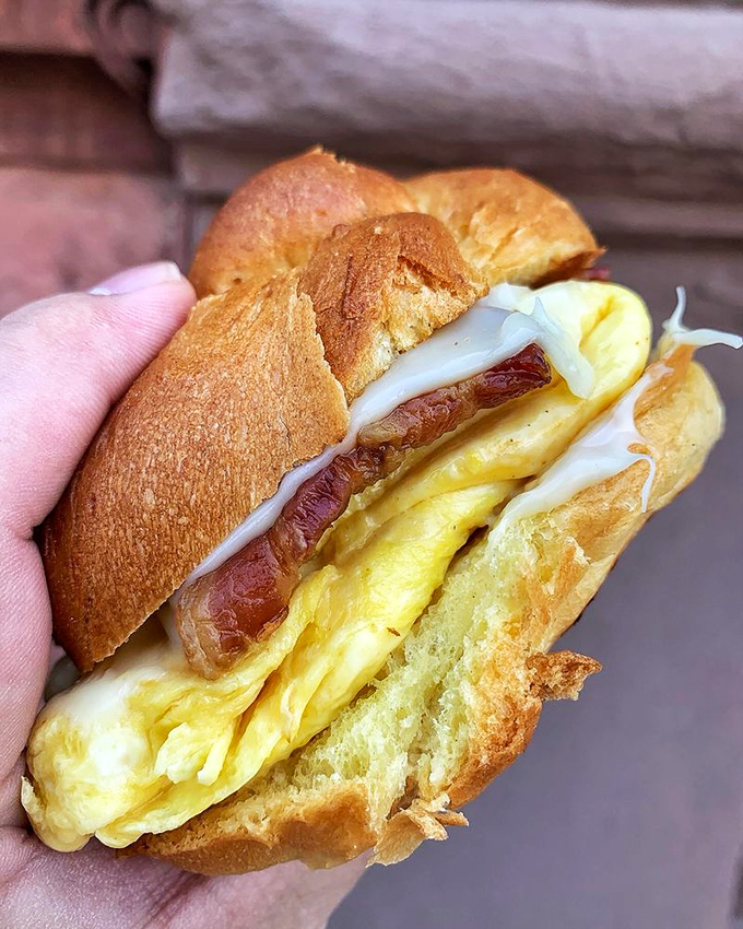 Breakfast sandwich perfection: the ideal bread-to-egg-to-bacon ratio that engineers study in their spare time. Portable joy that makes morning commutes bearable.