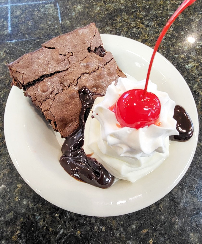 Chocolate meets whipped cream in a dessert love story. This brownie sundae with its cherry on top is the sweet finale every diner meal deserves.