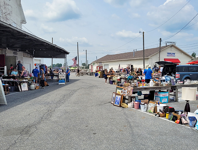 The heart of the market buzzes with activity. Like bees to flowers, shoppers navigate the rows in search of sweet deals.