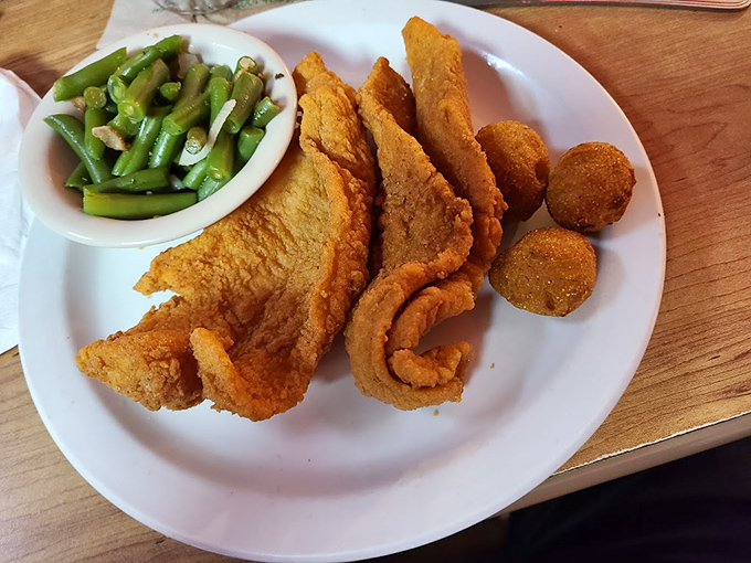 Crispy on the outside, tender within&mdash;this catfish dinner with hushpuppies is Southern comfort that speaks with a distinct Florida accent.