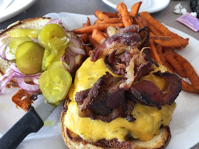 This isn't just another cheeseburger&mdash;it's a masterclass in proper ratios of meat, cheese, and toppings with sweet potato fries standing guard.