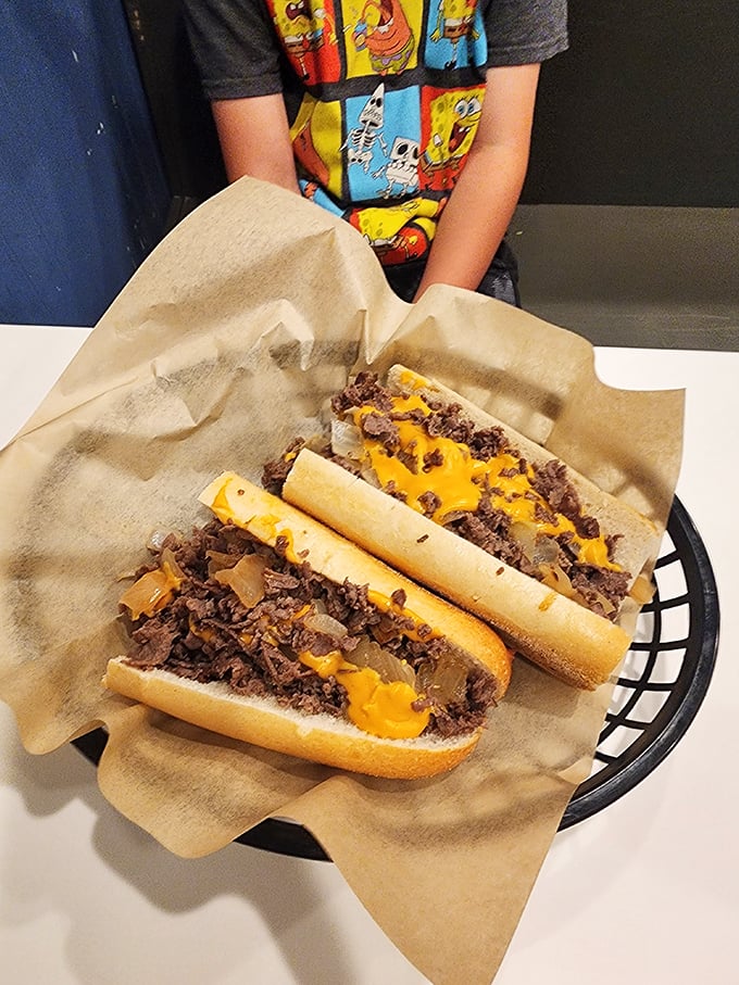Behold the holy trinity of cheesesteak perfection: thinly sliced beef, melted cheese, and caramelized onions on a roll that's both sturdy and yielding.
