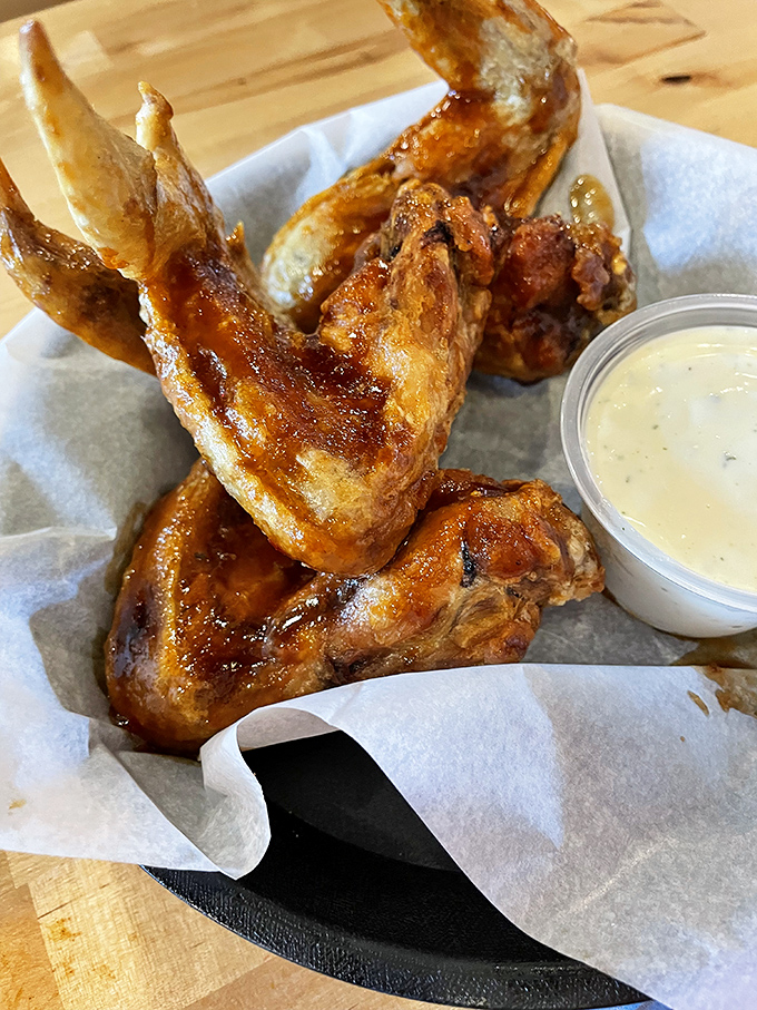 These wings aren't just cooked; they're transformed&mdash;crispy, saucy little miracles that make you wonder why you ever bothered with boneless.