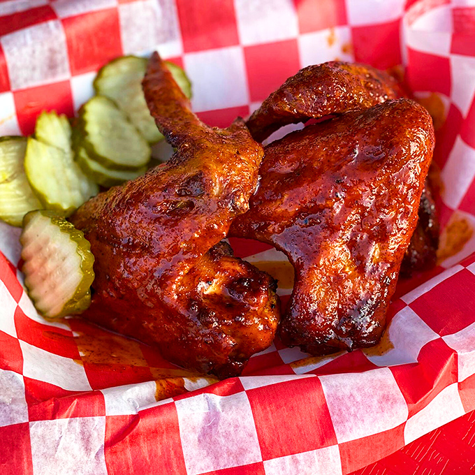 These wings aren't just cooked&mdash;they're transformed into glistening, sauce-lacquered treasures that demand to be devoured alongside those house-made pickles.