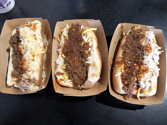 The holy trinity of chili dogs: perfectly aligned meat, cheese, and toppings. Like synchronized swimmers in a pool of deliciousness.