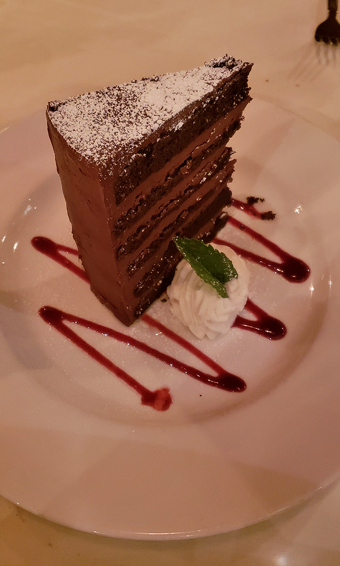 Seven layers of chocolate commitment that makes you wonder why anyone bothers with relationships when cake can be this devoted.