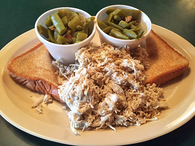 Southern comfort on a plate: tender pulled chicken with Texas toast and green beans cooked the way your grandmother would approve of.