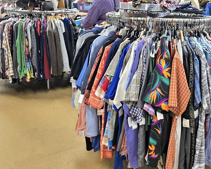 The men's shirt section: where Hawaiian prints and plaid flannel live in peaceful harmony, waiting for their chance to transform someone's wardrobe.