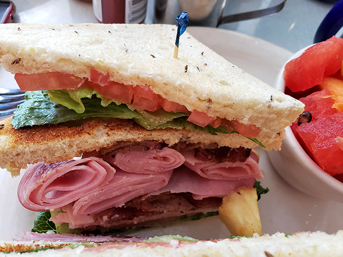 A club sandwich built with architectural precision&mdash;layers of deliciousness that would make a structural engineer proud and a food critic speechless.