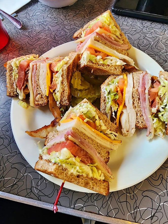 This club sandwich isn't stacked &ndash; it's architected, a towering monument to the art of sandwich engineering that dares you to unhinge your jaw.
