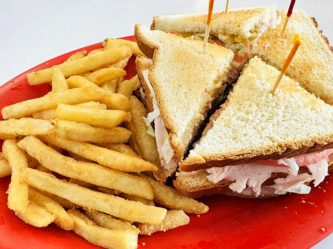 The club sandwich&mdash;stacked higher than my monthly bills&mdash;offers layers of comfort between perfectly toasted bread with a side of golden fry perfection.