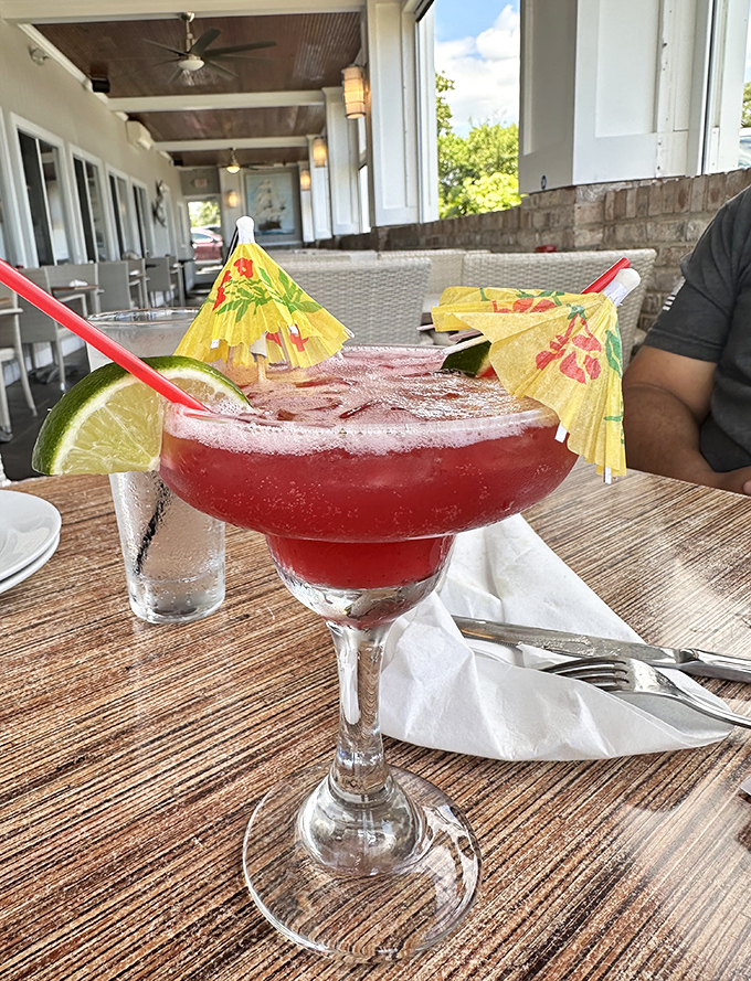 A vacation in a glass—this vibrant margarita with tiny umbrellas says "I might be in Connecticut, but my taste buds are on island time."