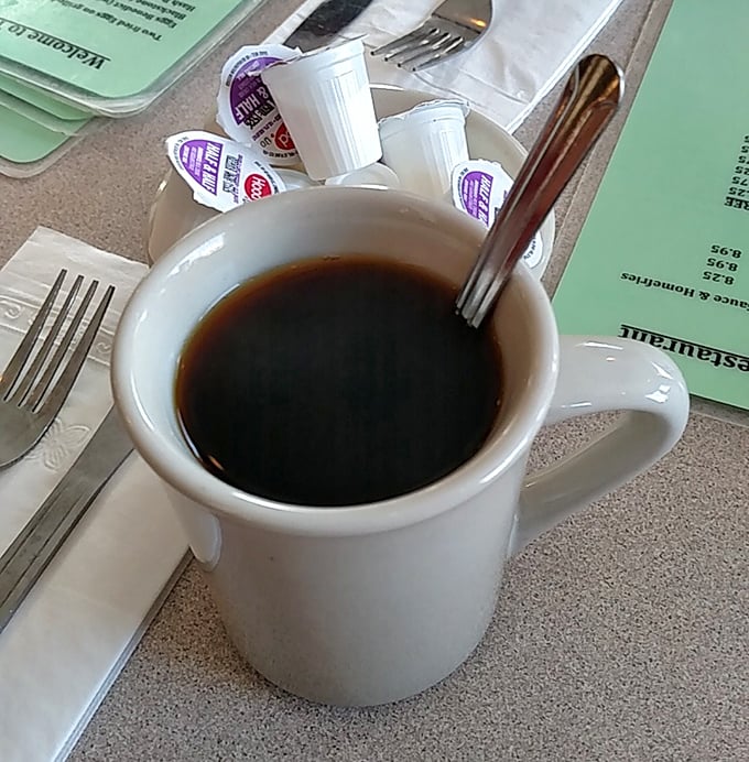 The humble diner coffee mug&mdash;civilization's most important vessel, delivering life-giving caffeine with no pretension, just honest warmth and refills.