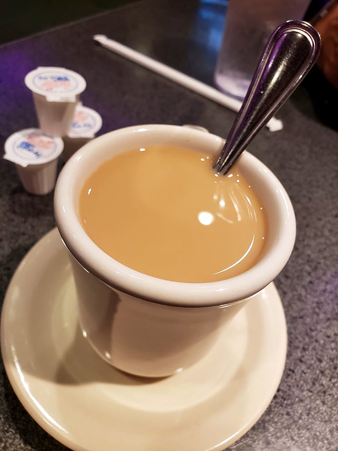 The humble coffee cup &ndash; holding the elixir that makes morning conversations possible. In diners, the first cup is just the beginning of a beautiful friendship.