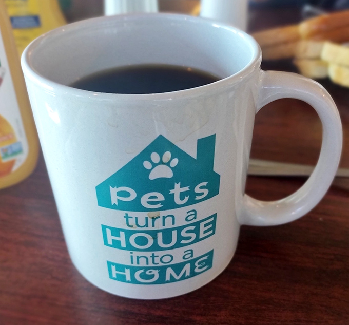That coffee mug speaks the truth: pets turn houses into homes, and diners turn meals into memories.