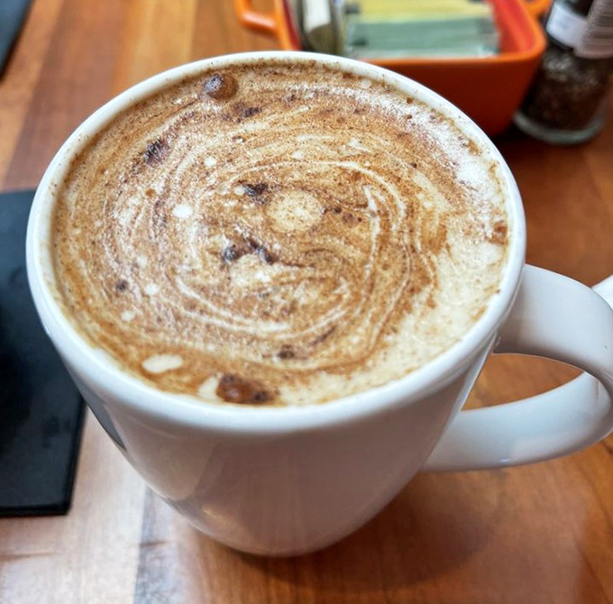 Coffee art so pretty you almost don't want to drink it&mdash;almost. The swirls of cinnamon atop this latte are like the opening credits to your morning's main feature.