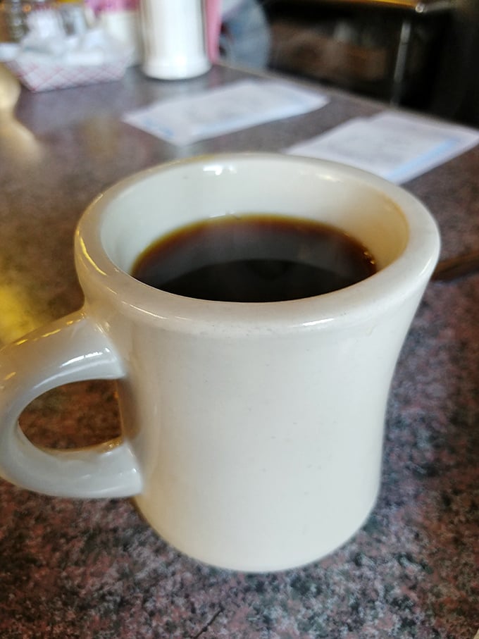 This isn't just coffee &ndash; it's liquid resilience in a sturdy white mug, ready to resurrect you from whatever French Quarter adventures transpired the night before.