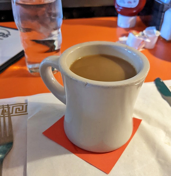 The classic diner mug cradles coffee like it's liquid gold &ndash; simple, sturdy, and promising to transform you from zombie to human with each sip.
