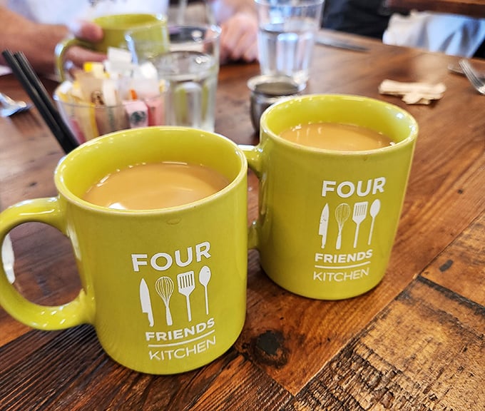 The cheerful yellow mugs aren't just containers&mdash;they're morning mood enhancers, filled with coffee robust enough to jumpstart even the most reluctant Monday.