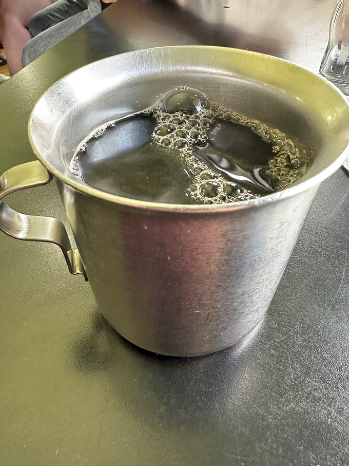 Even the coffee arrives with attitude – served in a no-nonsense metal pot that says, "I'm not here to look pretty. I'm here to wake you up."