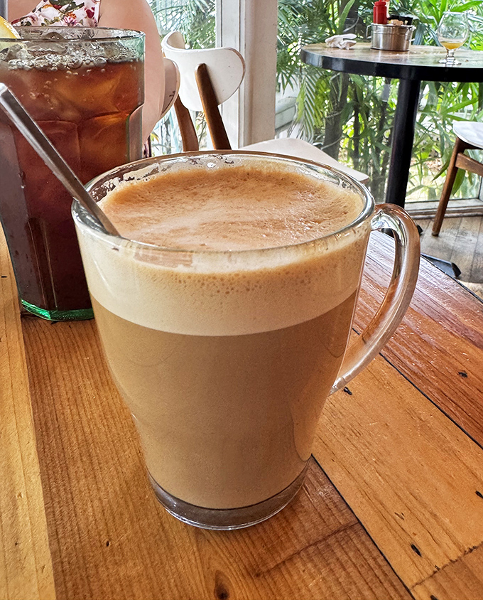 Coffee served in a glass mug large enough to swim in&mdash;because vacation mornings deserve more than just a standard cup of joe. 