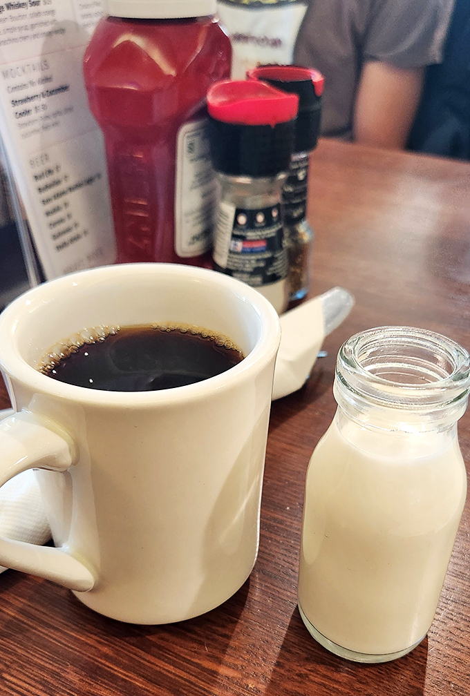 The classic diner coffee ritual&mdash;dark brew in a sturdy mug with milk in those adorable little bottles. Morning meditation, Jersey-style.