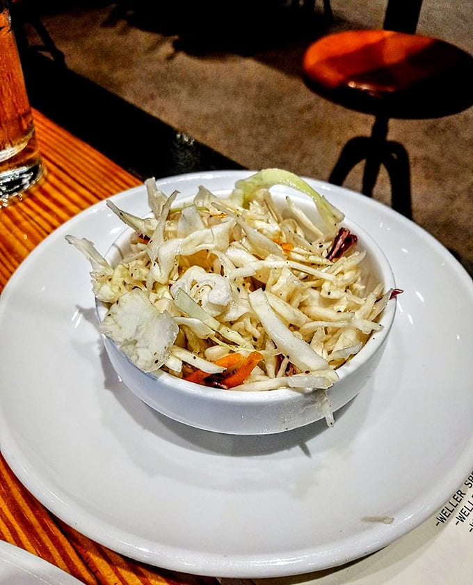 This isn't just coleslaw; it's the palate-cleansing sidekick your smoked meat deserves, crisp and bright with just the right amount of tang.