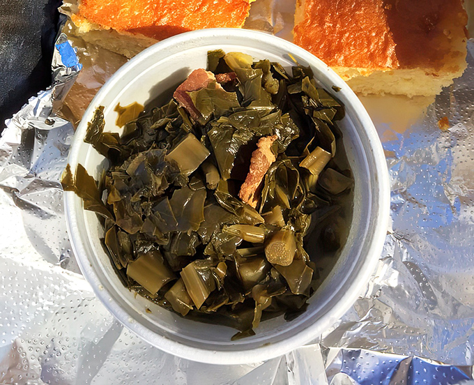 Collard greens cooked with bits of pork&mdash;because vegetables should never have to face the world alone. The perfect counterpoint to all that meat.