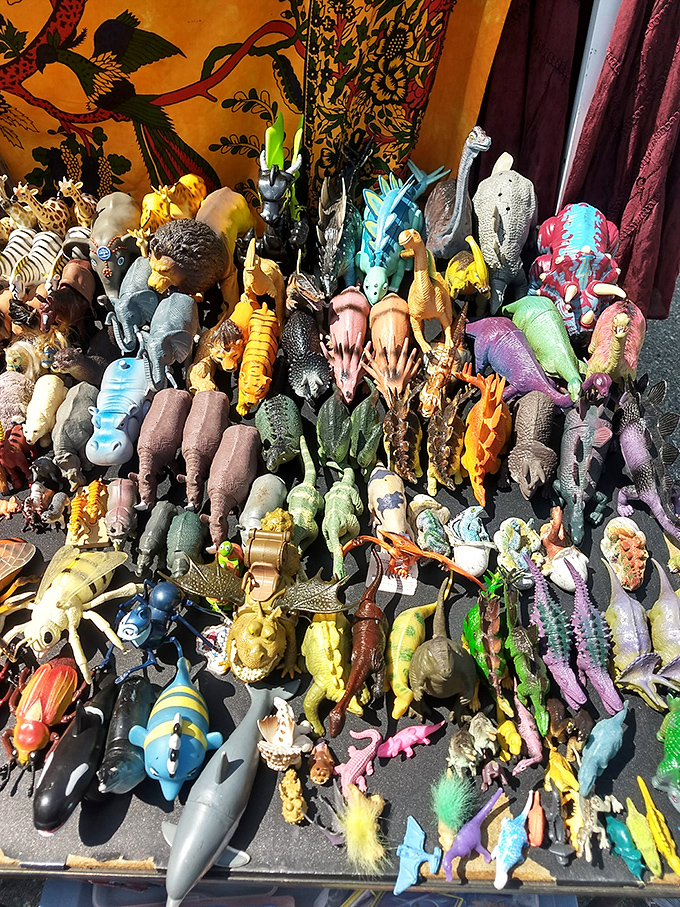 Prehistoric plastic paradise. One person's forgotten toy chest becomes another's nostalgic collection—dinosaurs never really go extinct at flea markets.