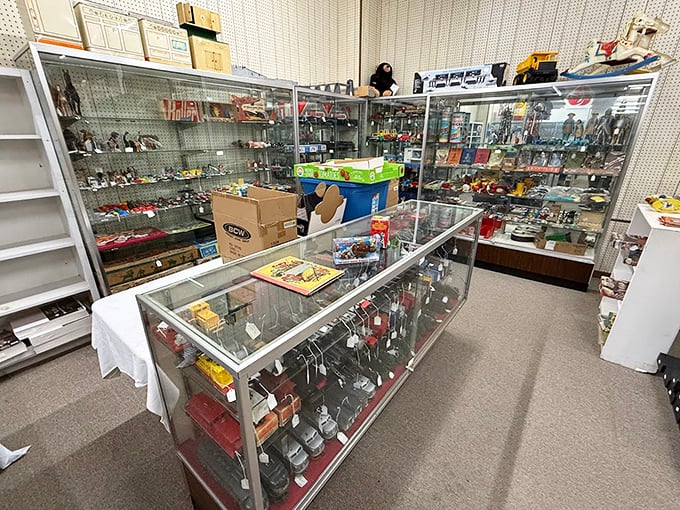 Glass display cases protect delicate collectibles and toys, each item a small piece of history.