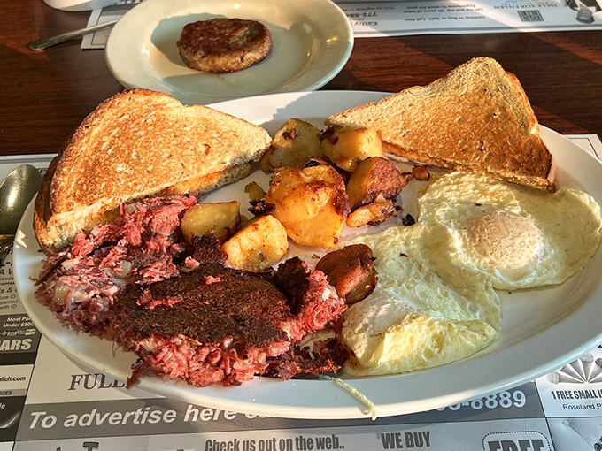 Corned beef hash that would make your grandmother weep with joy, paired with sunny-side-up eggs that practically high-five your taste buds.