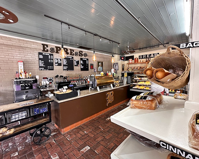 The espresso counter stands ready for duty, a caffeine command center where baristas transform beans into liquid motivation behind that iconic "B" logo.
