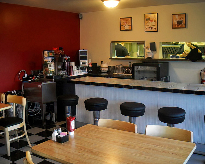 Where the magic happens—counter seating for breakfast voyeurs. Watch your heavenly hotcakes being flipped with the precision of Olympic gymnasts.