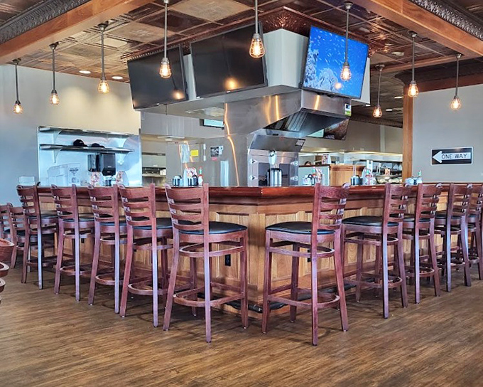 The counter seating offers front-row tickets to the culinary show, where breakfast dreams become delicious reality.