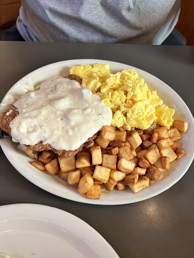 Country fried steak that your cardiologist warned you about. The gravy doesn't just cover the meat&mdash;it embraces it like a long-lost relative.