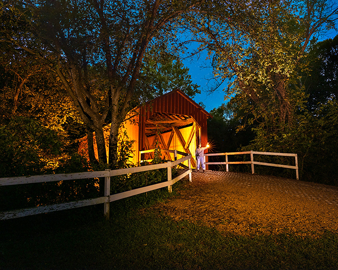 As twilight falls, the bridge transforms into something magical, like a Thomas Kinkade painting with better lighting and fewer cottages.