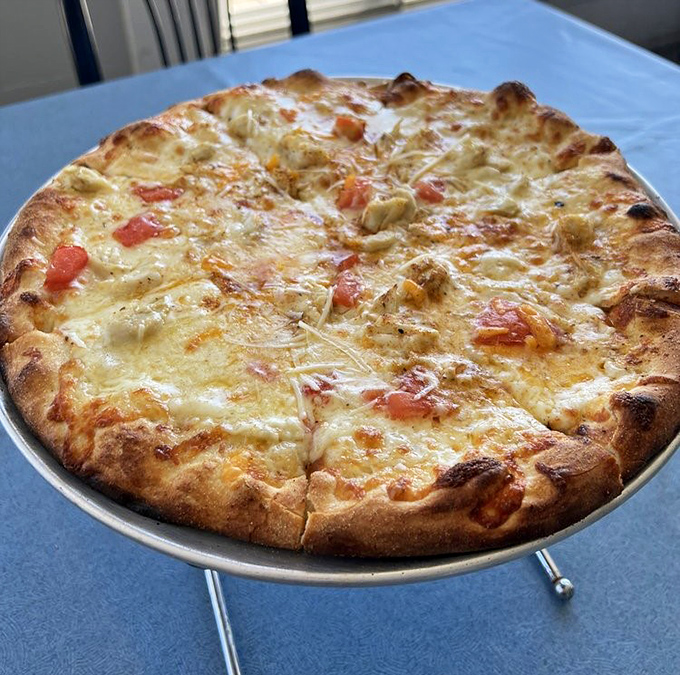 Pizza meets Chesapeake Bay in this beautiful marriage where tomato sauce steps aside to let crab become the star.